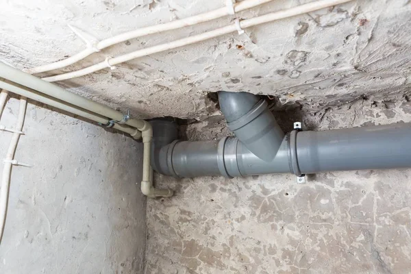 Sewer pipes in home basement Stock Photo by ©Milosz_ 132102144