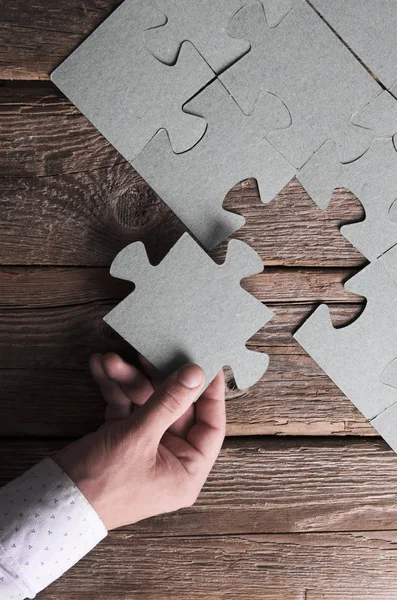 Incomplete puzzles lying on wooden rustic boards. - Stock Image ...