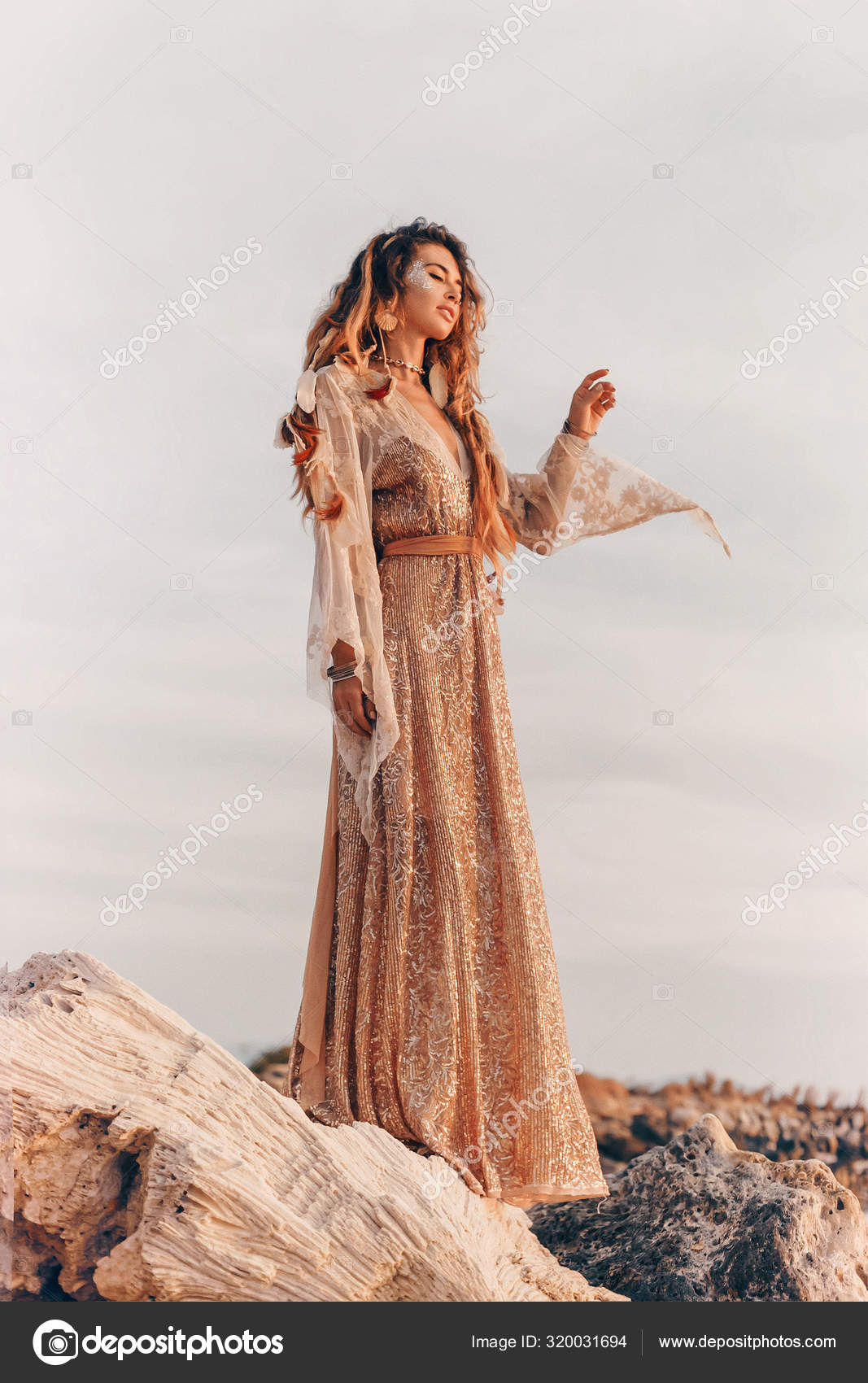 Beautiful young woman in boho dress on the beach at sunset Stock Photo ...