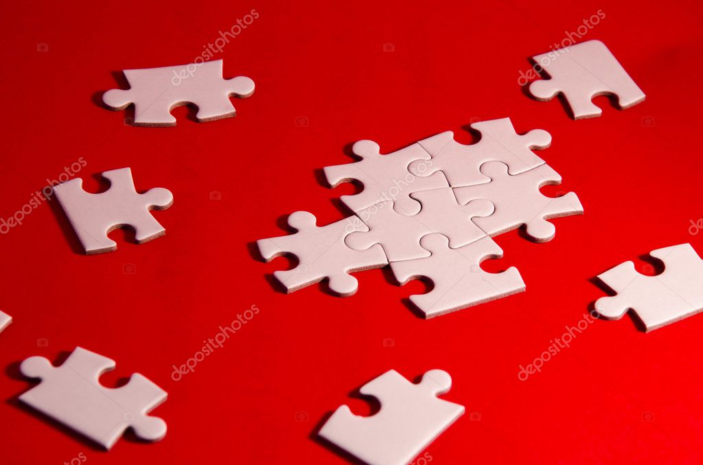 Solving the puzzle Stock Photo by ©marinzolich 126980472