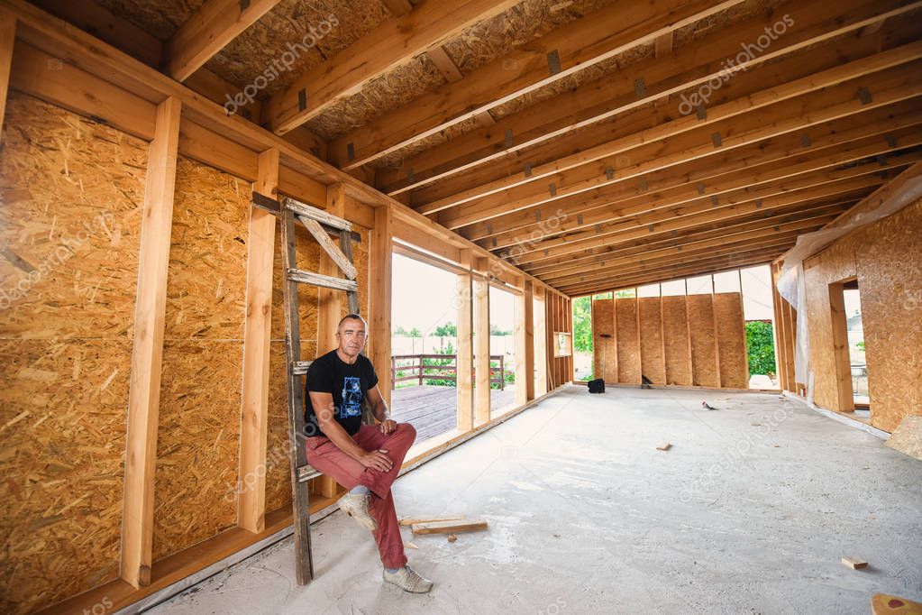 Construction and Building New frame house Man are working on building a ...