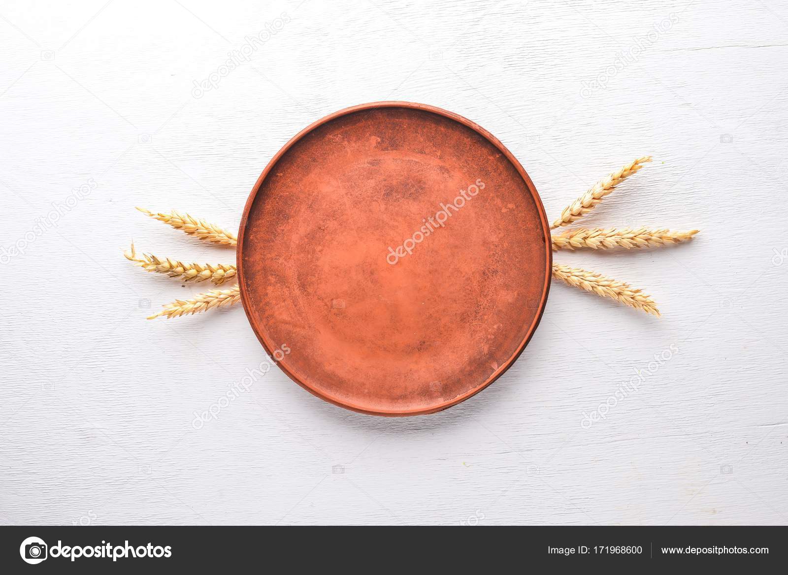 Clay pot. Dishes. On a wooden background. Top view. Free space. Stock ...