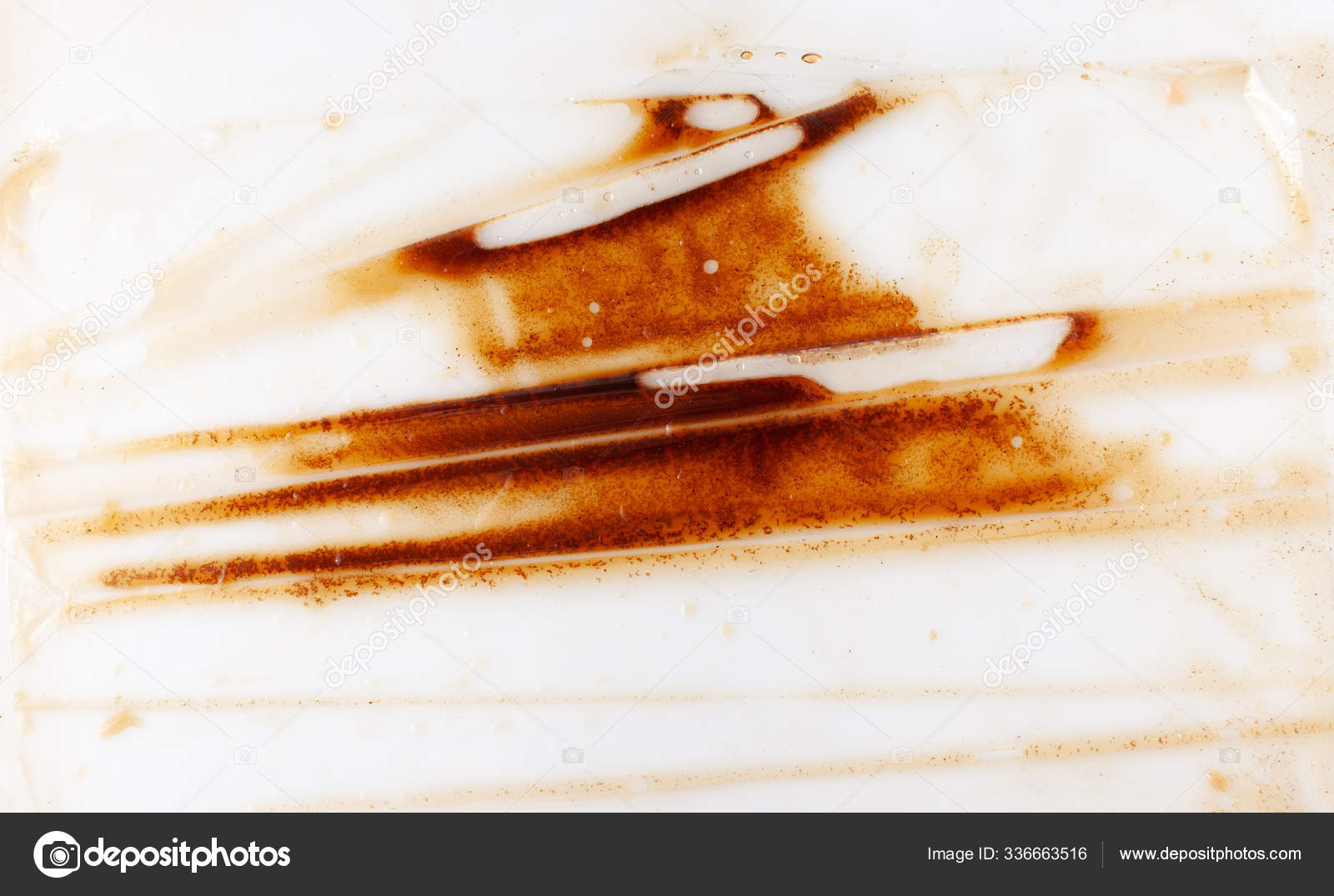 Background texture of a polyethylene transparent film with brown liquid ...