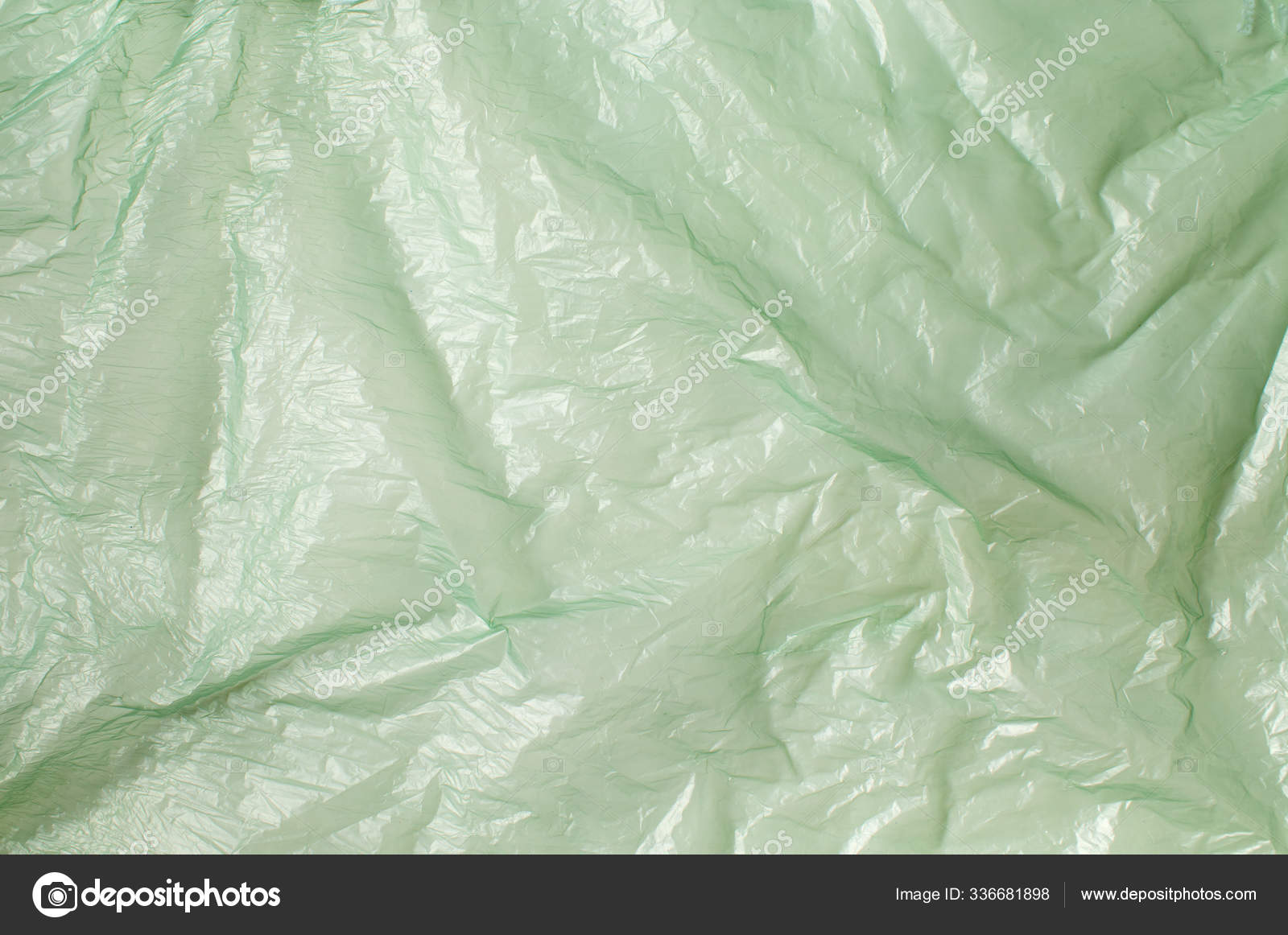 Background texture of a polyethylene transparent green film — Stock ...