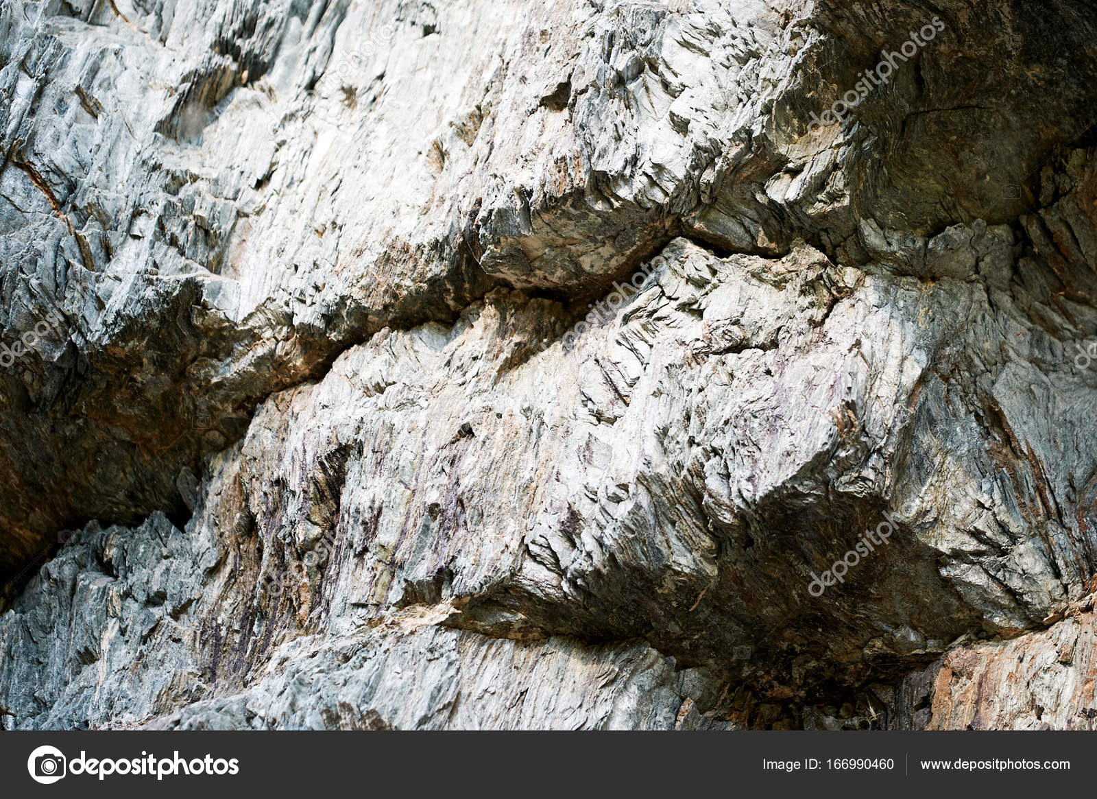 Rock of slate, the structure of the stone is a complex relief. Stock ...