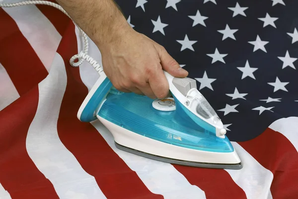 Ironing Out the Wrinkles in U.S. Flag — Stock Photo © Feverpitch #2328470