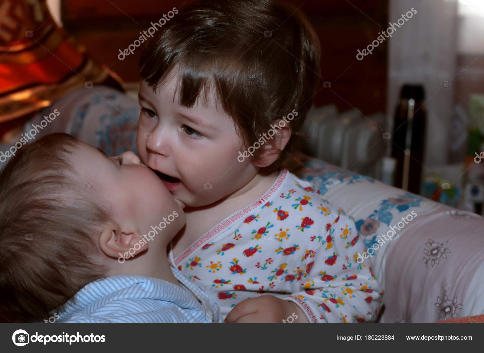 Two kids kissing Stock Photo by ©alexkich 180223884