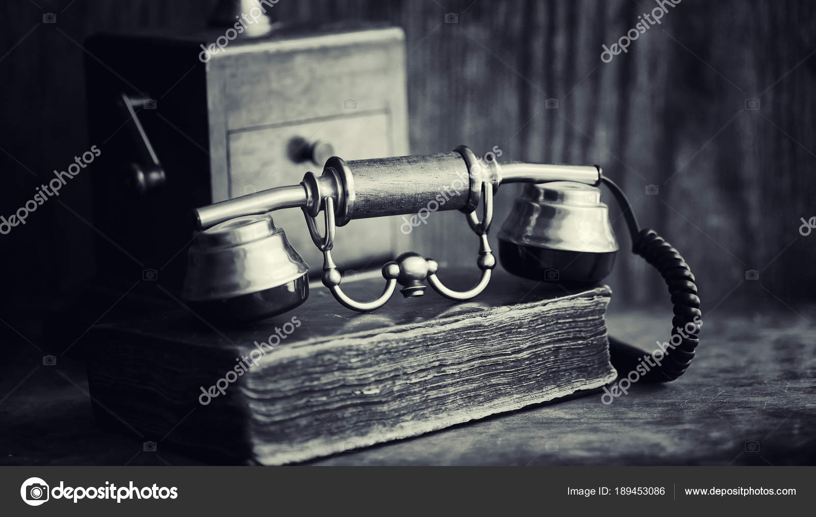 Old telephone and retro book on the desk. The phone of the past Stock ...