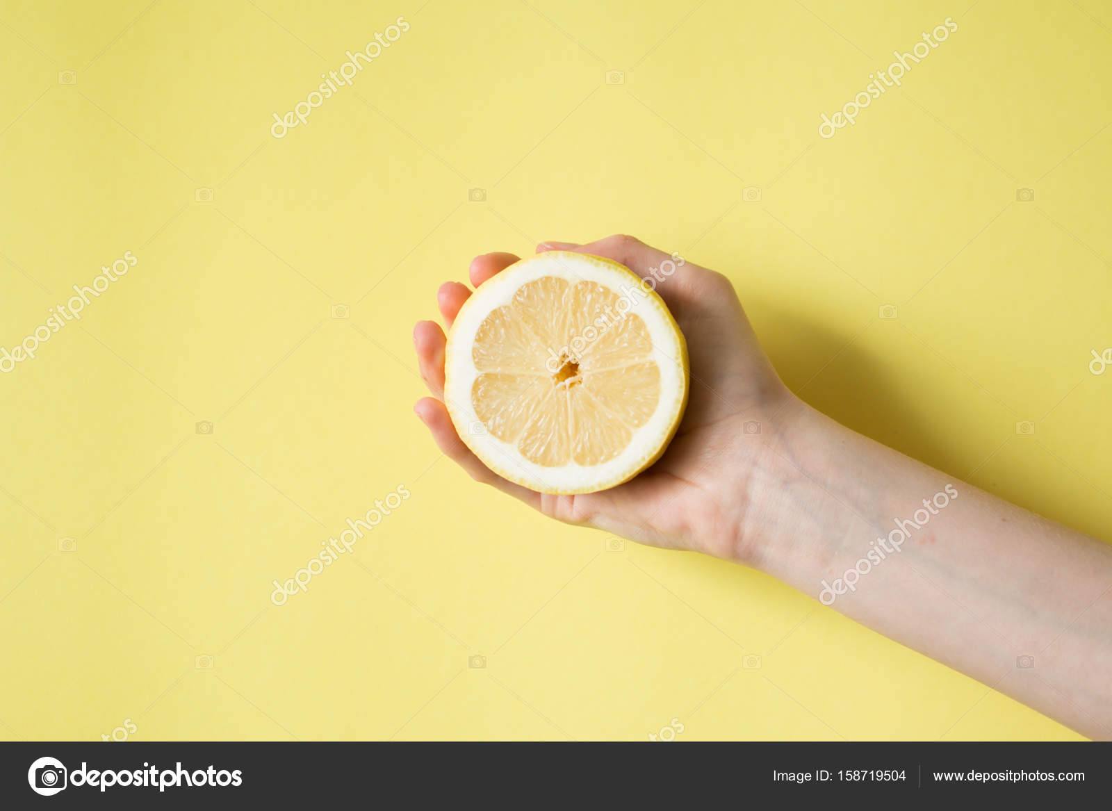 Lemon in woman's hand on a yellow background Stock Photo by ©crisper85 ...
