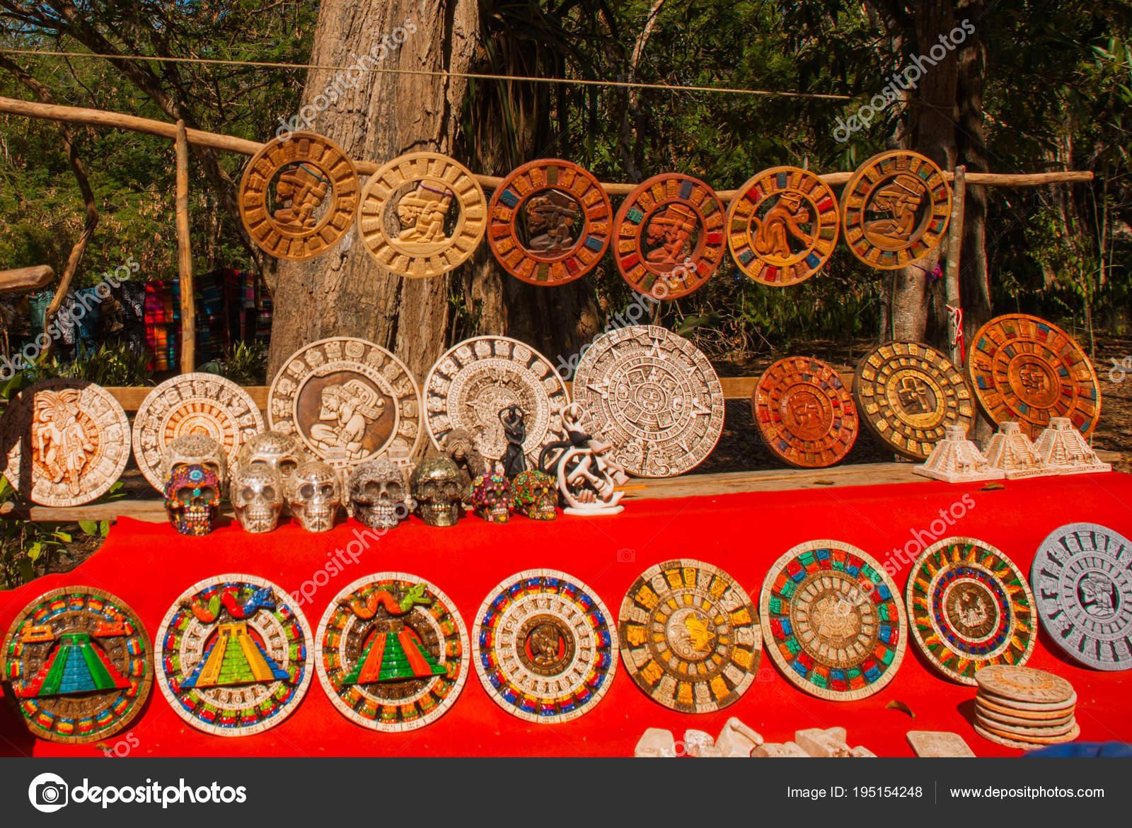 Souvenirs from Mexico in the market. Mexican Mayan crafts, plates ...