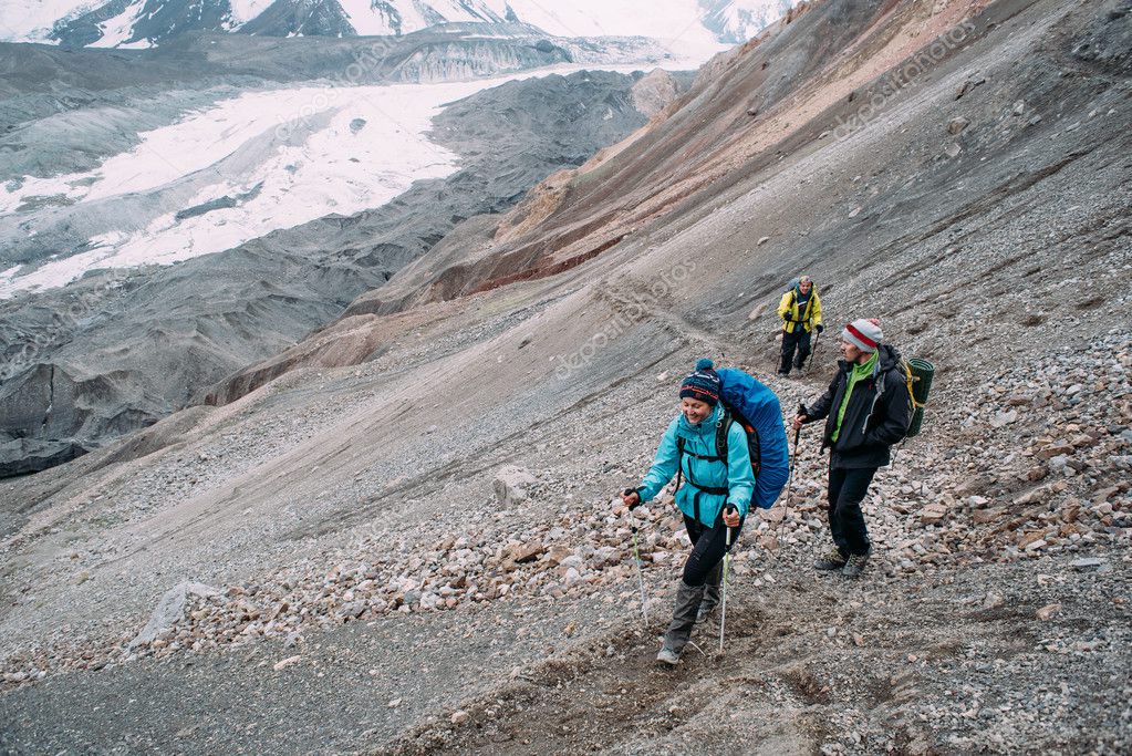 People climbing in mountains Stock Photo by ©kurapatka 126471628