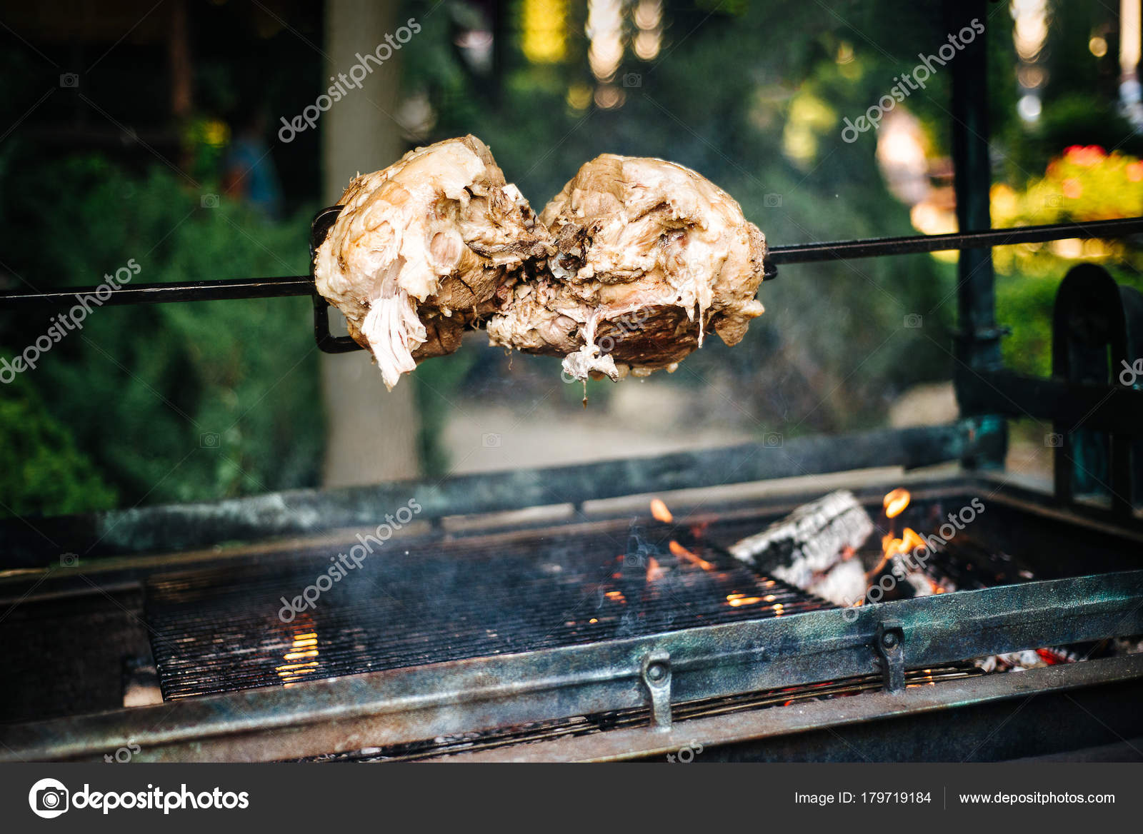 Large chunk of pork cooking on open fire, flame outdoors — Stock Photo ...