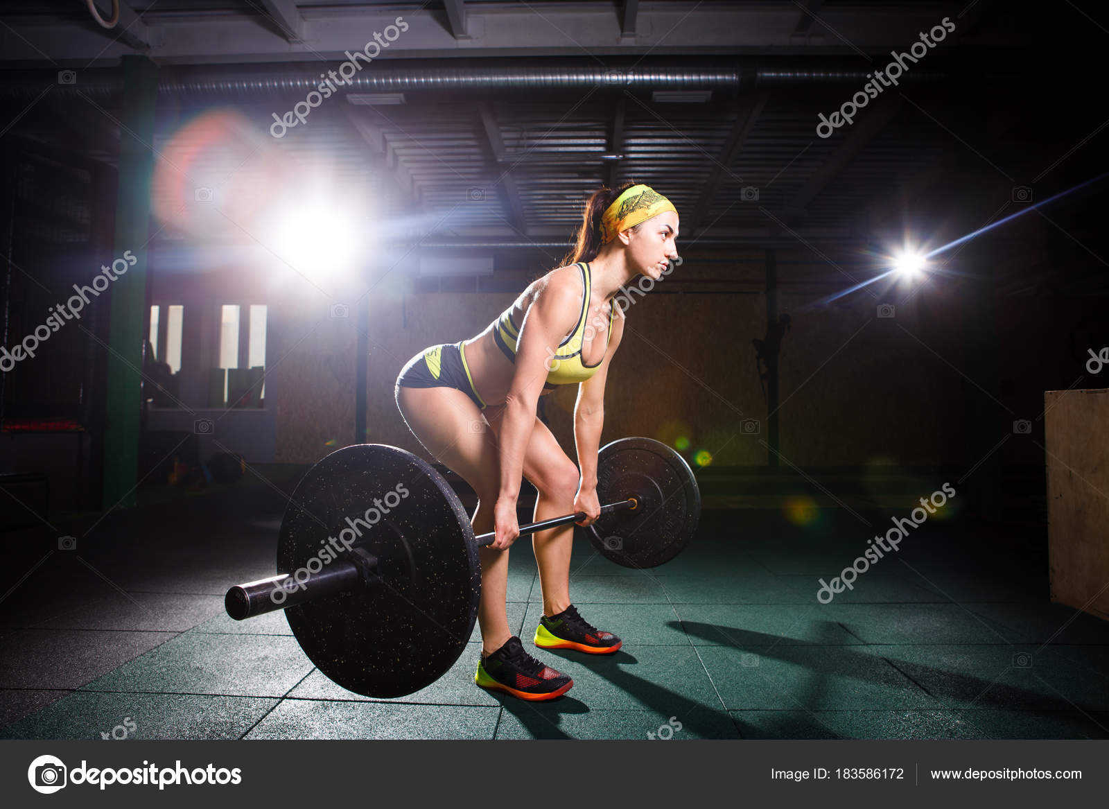 Strong Woman Lifting Barbell As A Part Of Crossfit Exercise Routine