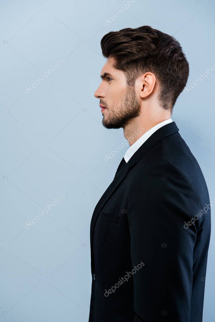 Side view of confident serious man in black suit — Stock Photo ...
