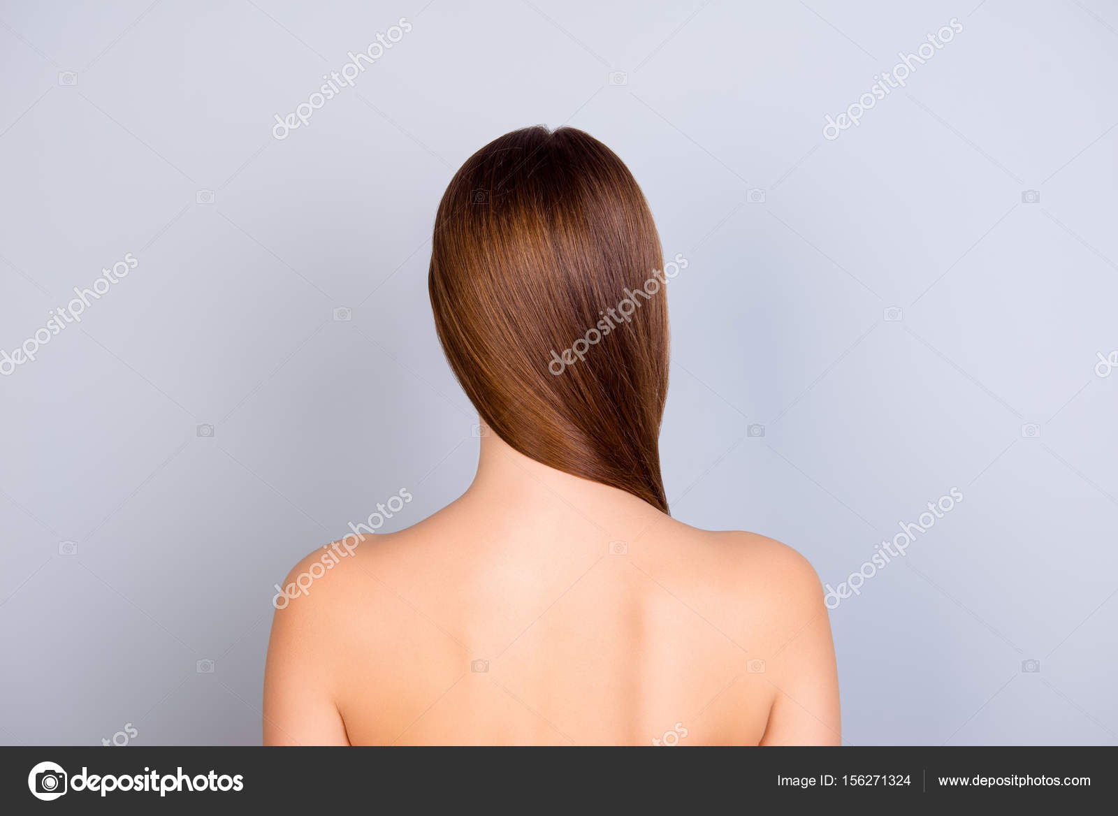 Close up cropped back view photo of young brown haired girl stan ...