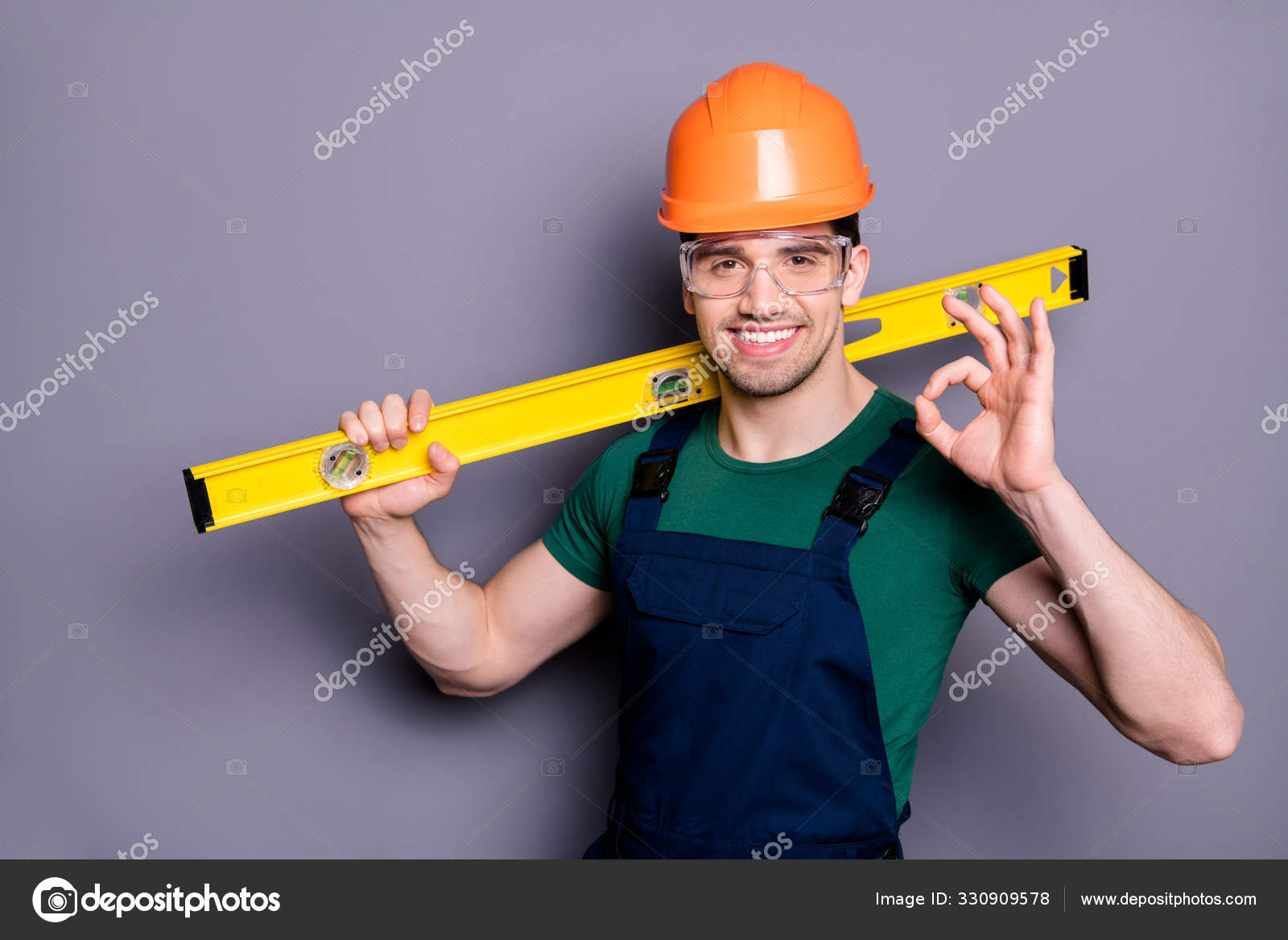 Good work. Photo of handsome timber guy skilled engineer hold measure ...