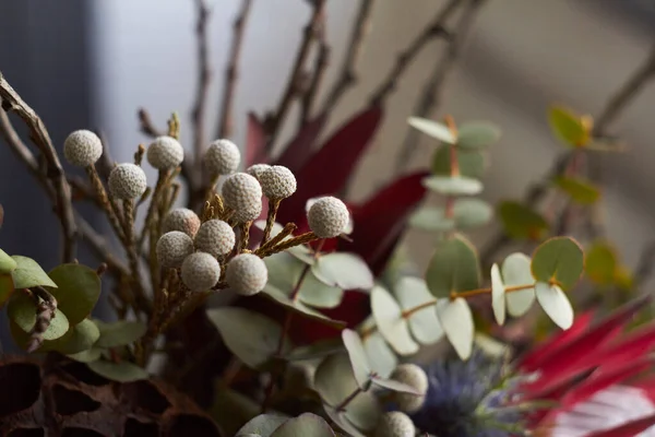 Close-up details of exotic bouquet without packaging stands on table ...