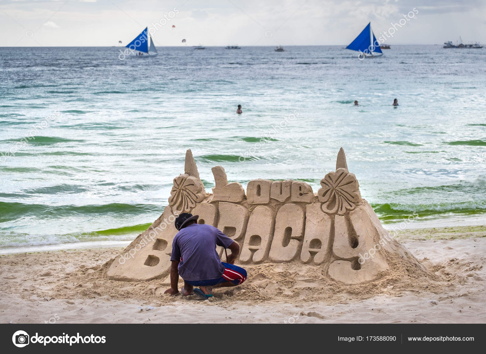 Little boy making sand tower castle at white beach of Boracay is Stock ...