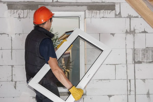 Installation of plastic windows Stock Photo by ©mkuchina 154895852