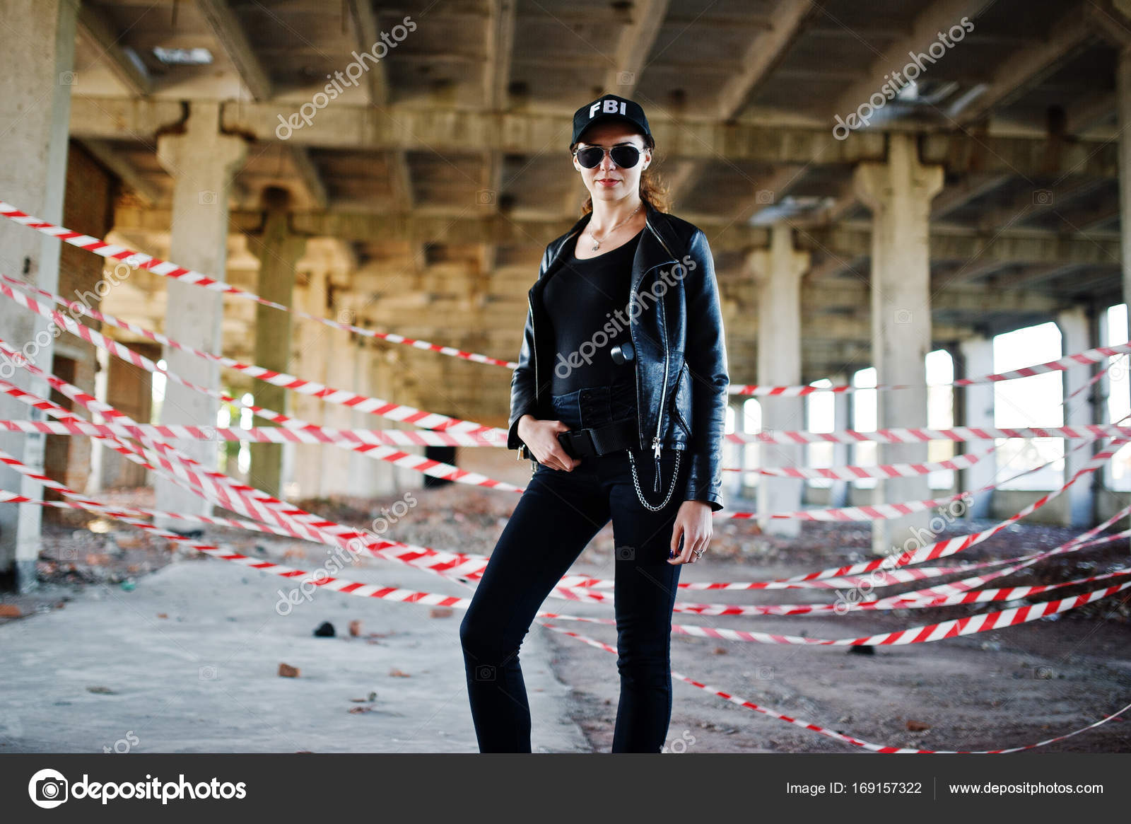 Sexy FBI female agent at abadoned place. — Stock Photo © ASphoto777 #169157322