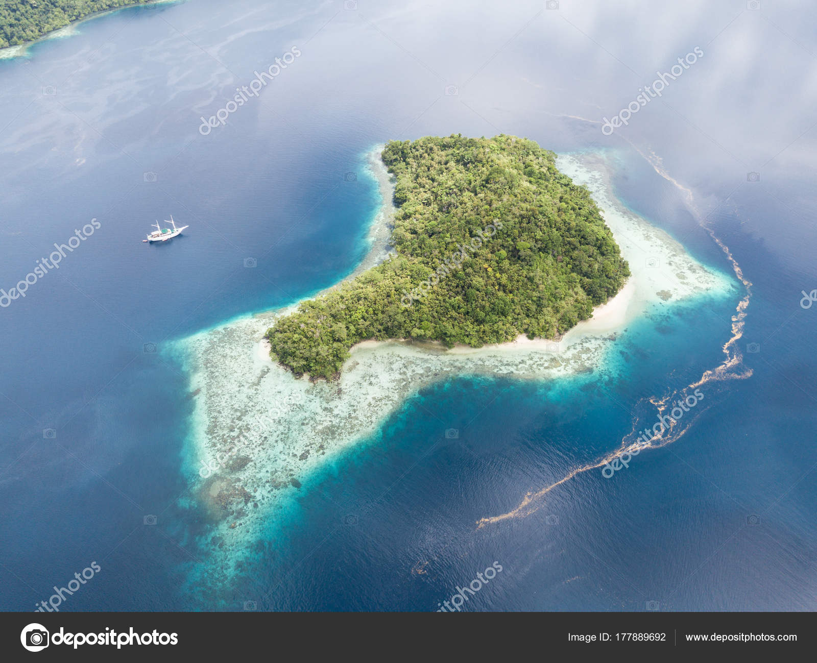 Small Ship Rests Anchor Remote Island Surrounded Shallow Coral Reefs ...