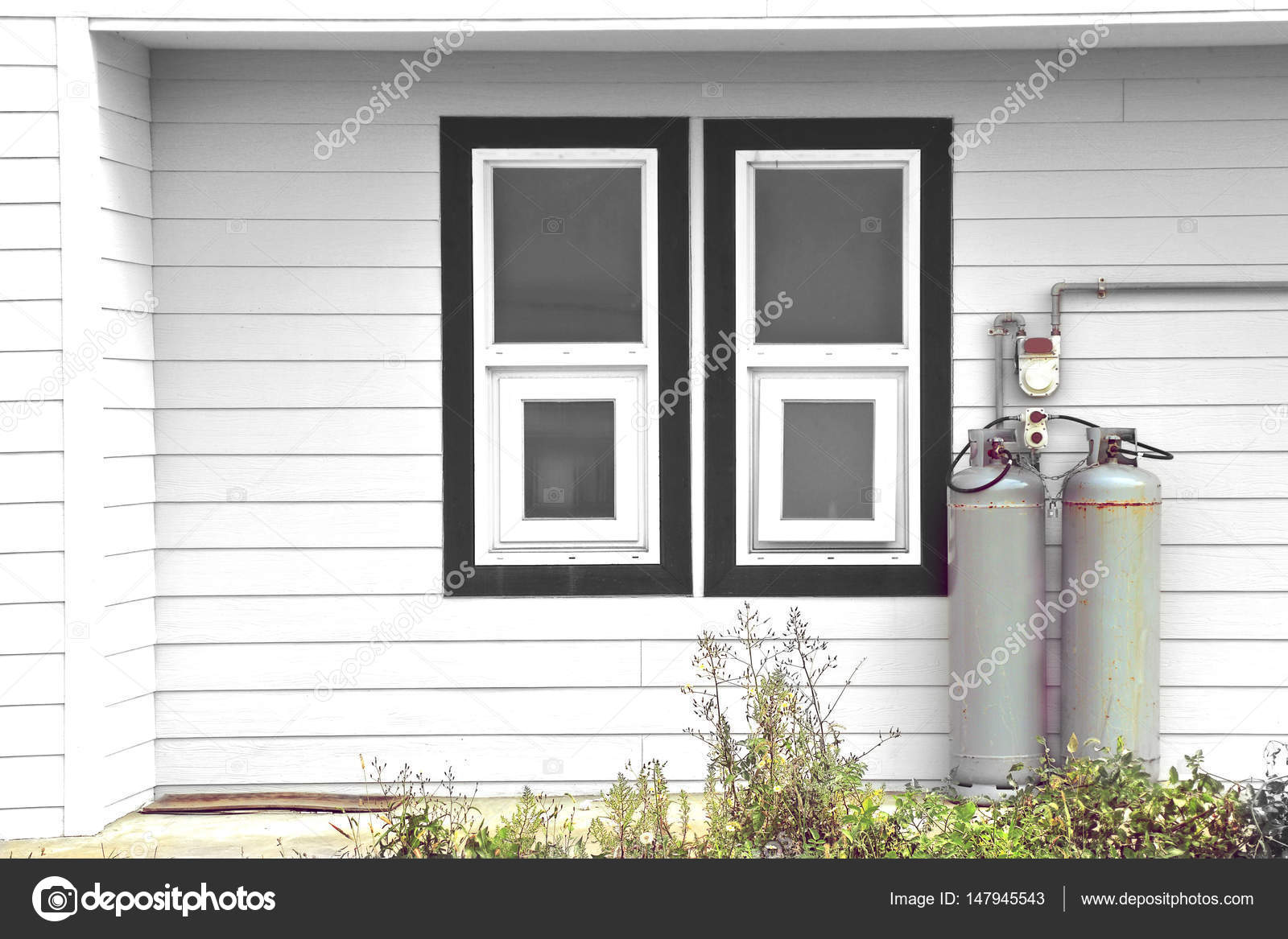 Gas bottles standing outside wall of house — Stock Photo © thanasus ...