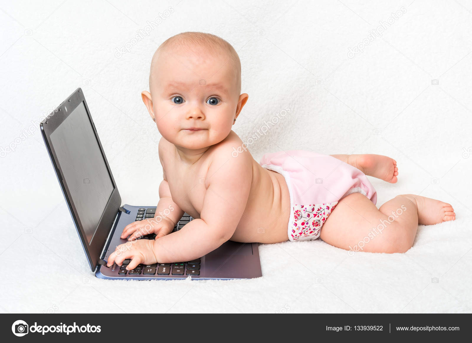 Cute baby typing on a laptop computer isolated on white Stock Photo by ...