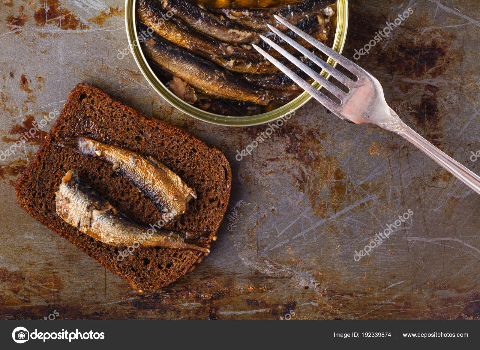 Open canned fish near fork on rustic background — Stock Photo ...