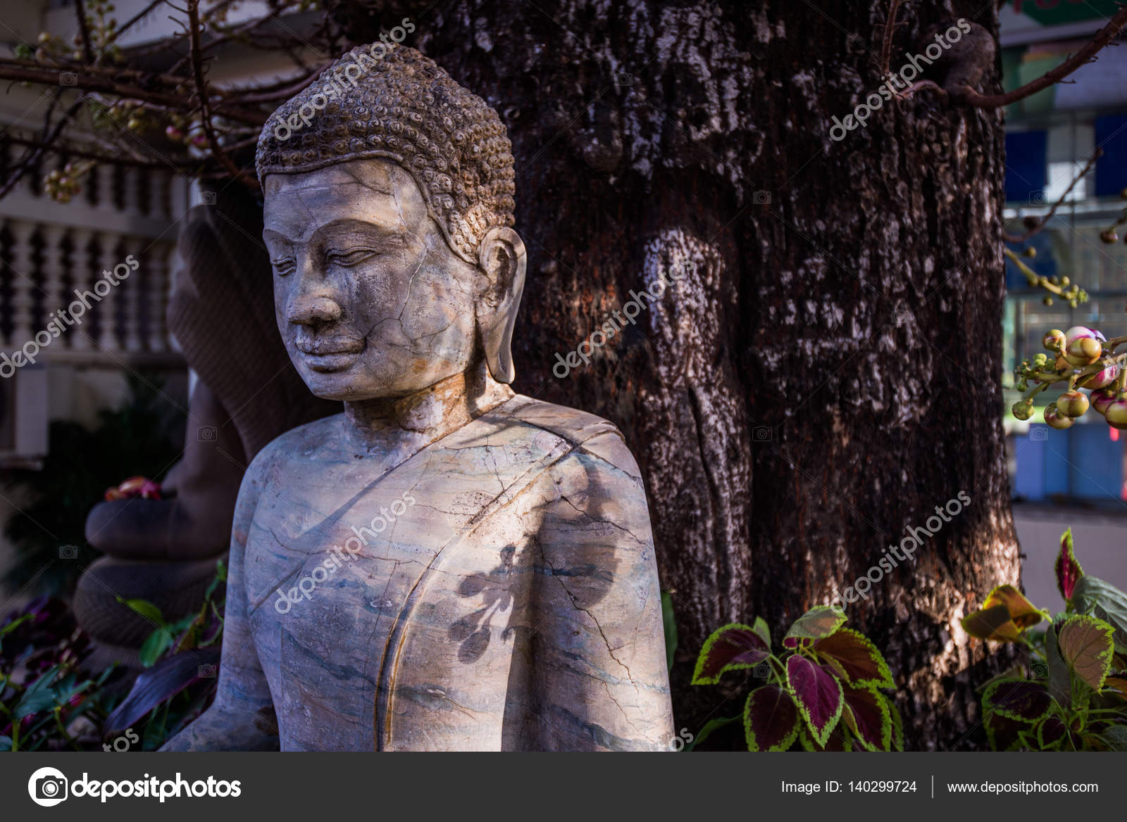 The stone Buddha statue in forest background Stock Photo by ...