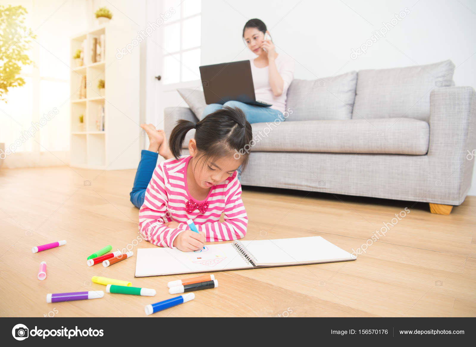 Kids drawing and mother working Stock Photo by ©primagefactory 156570176