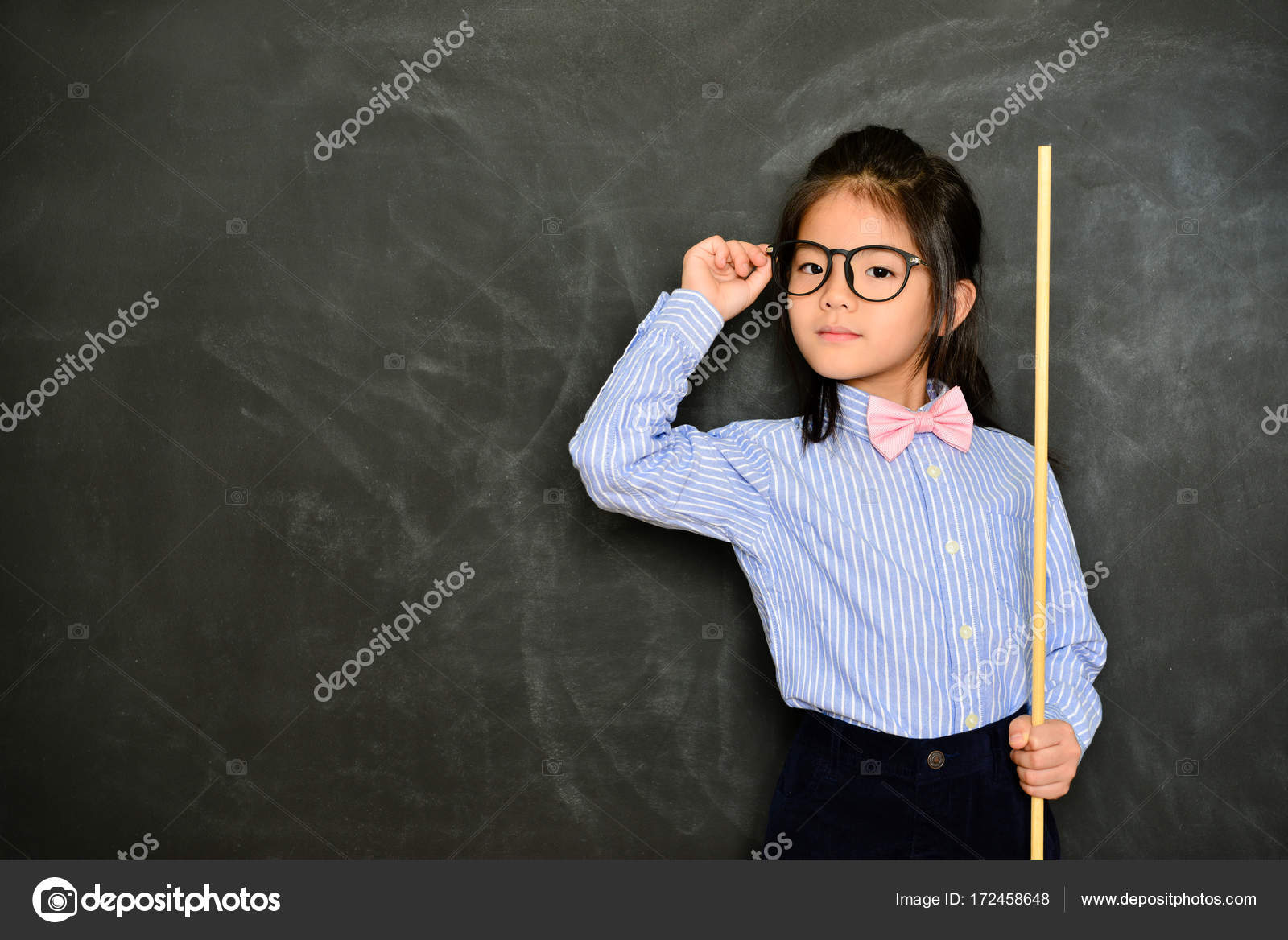 Female tutor using stick teaching study class Stock Photo by ...