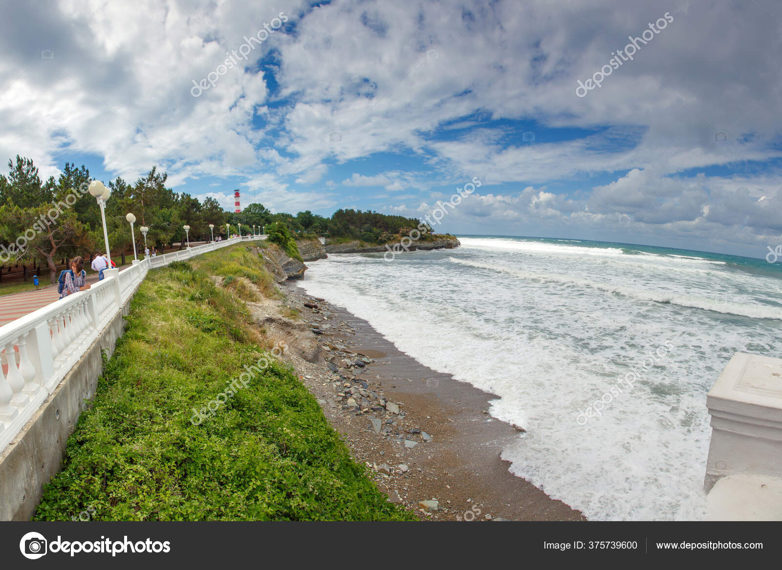 Storm in Gelendzhik Bay. Beach of Gelendzhik resort. Storm waves roll ...