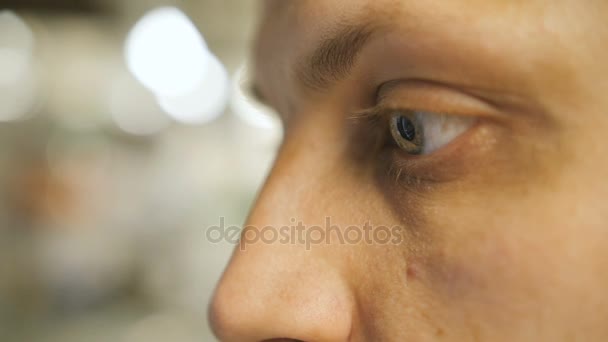 Eyes of the young man closeup side view. — Stock Video © madWTF #152680324