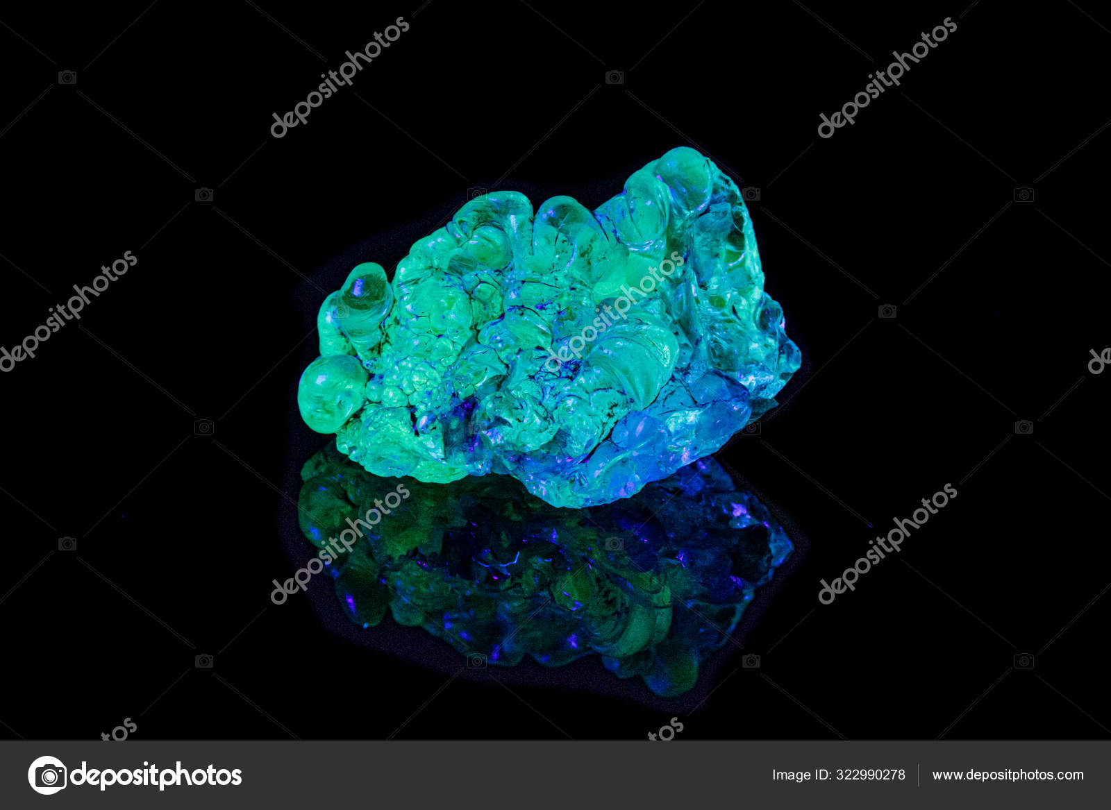 Macro mineral stone opal under ultraviolet light on a black back ...