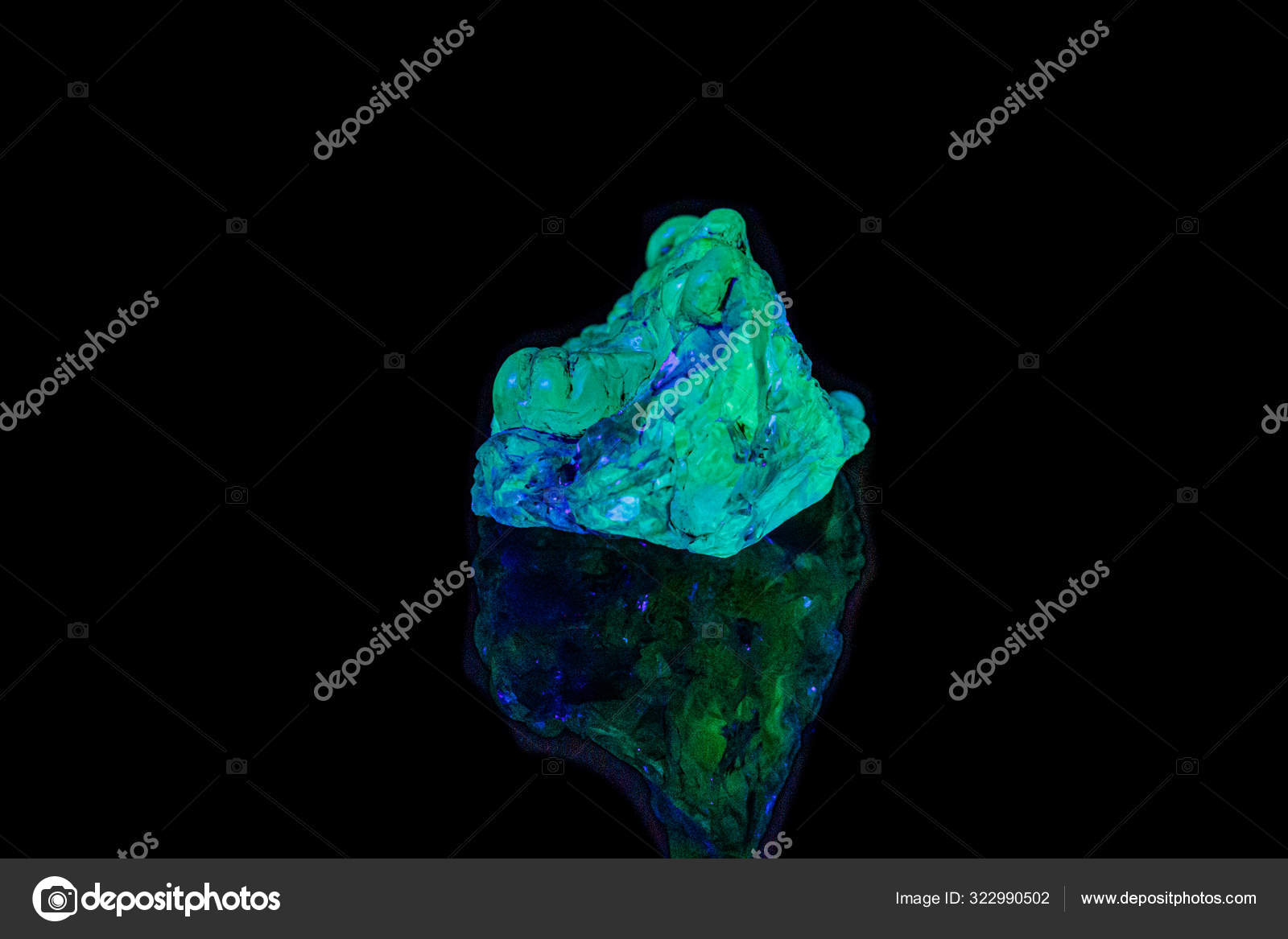 Macro mineral stone opal under ultraviolet light on a black back ...