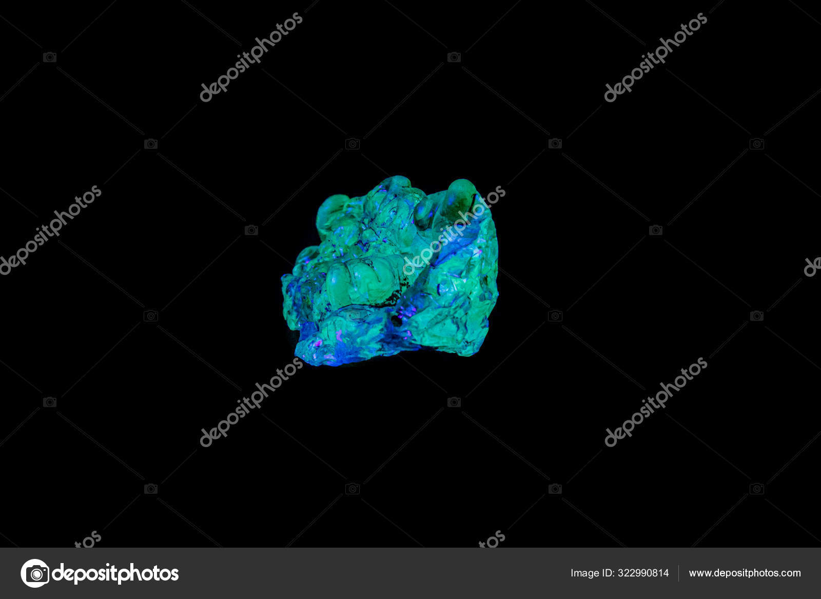 Macro mineral stone opal under ultraviolet light on a black back ...