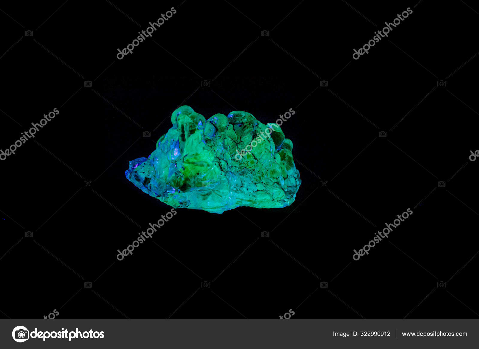 Macro mineral stone opal under ultraviolet light on a black back ...