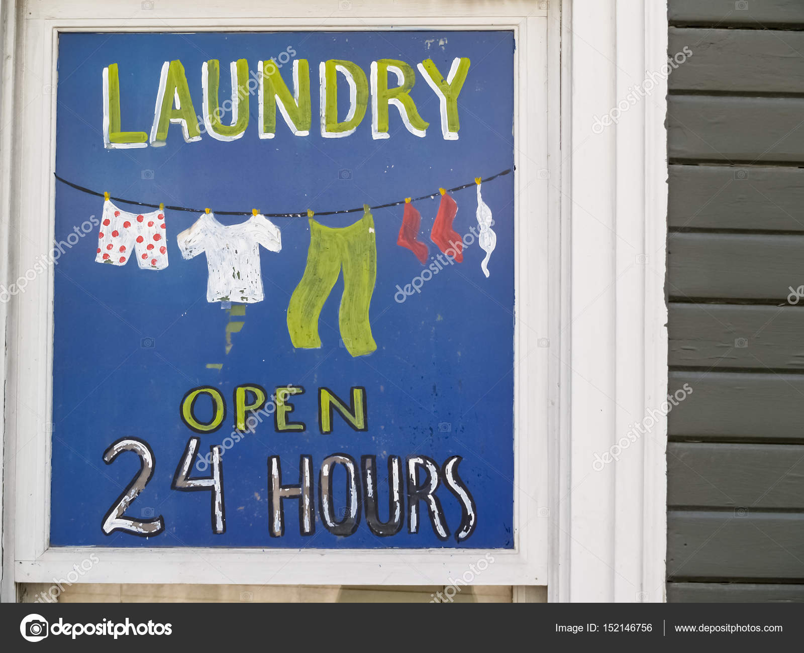 Hand painted sign advertizing home laundry business — Stock Editorial ...