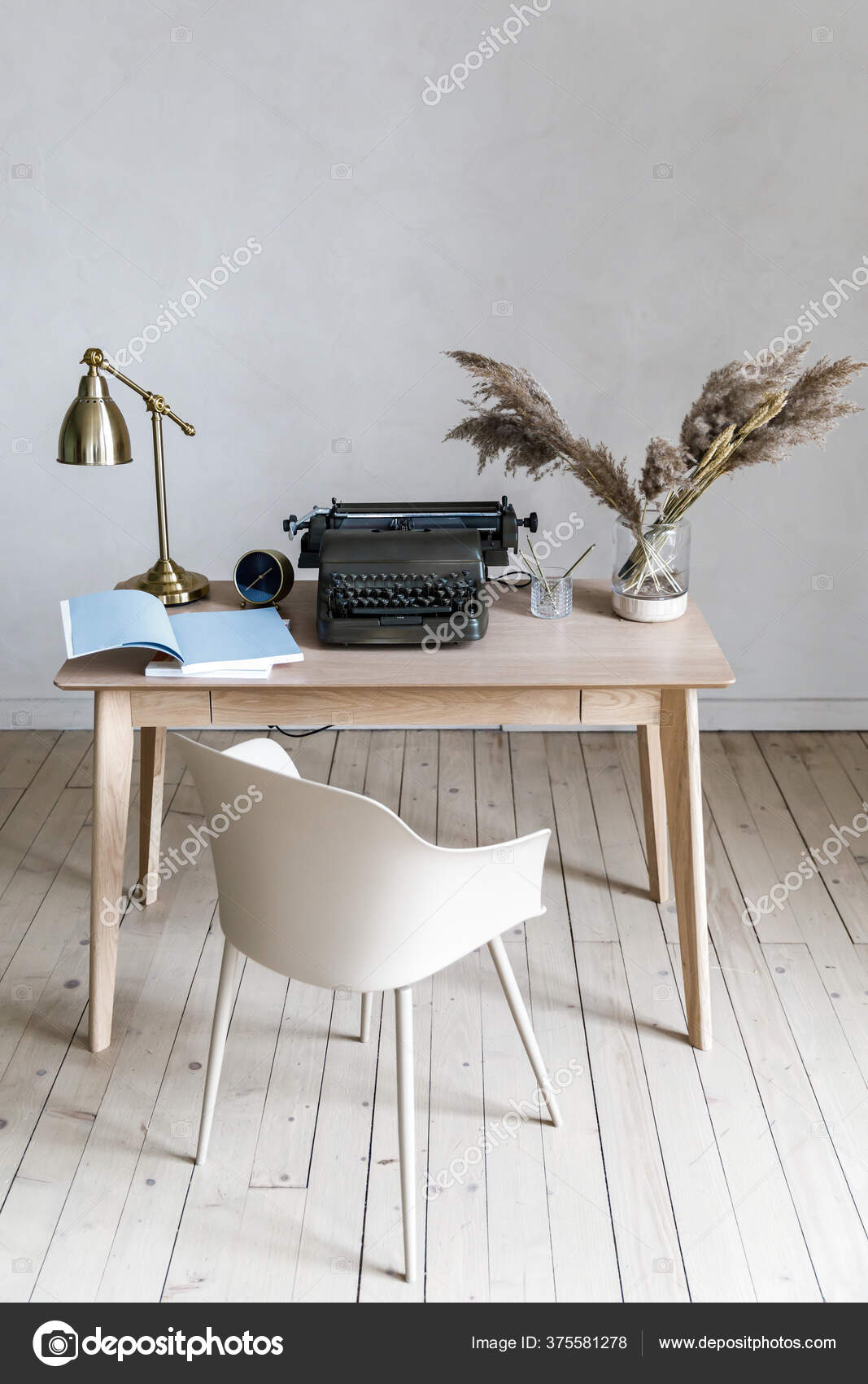 Front view picture of studio workplace. Designer comfortable work table ...