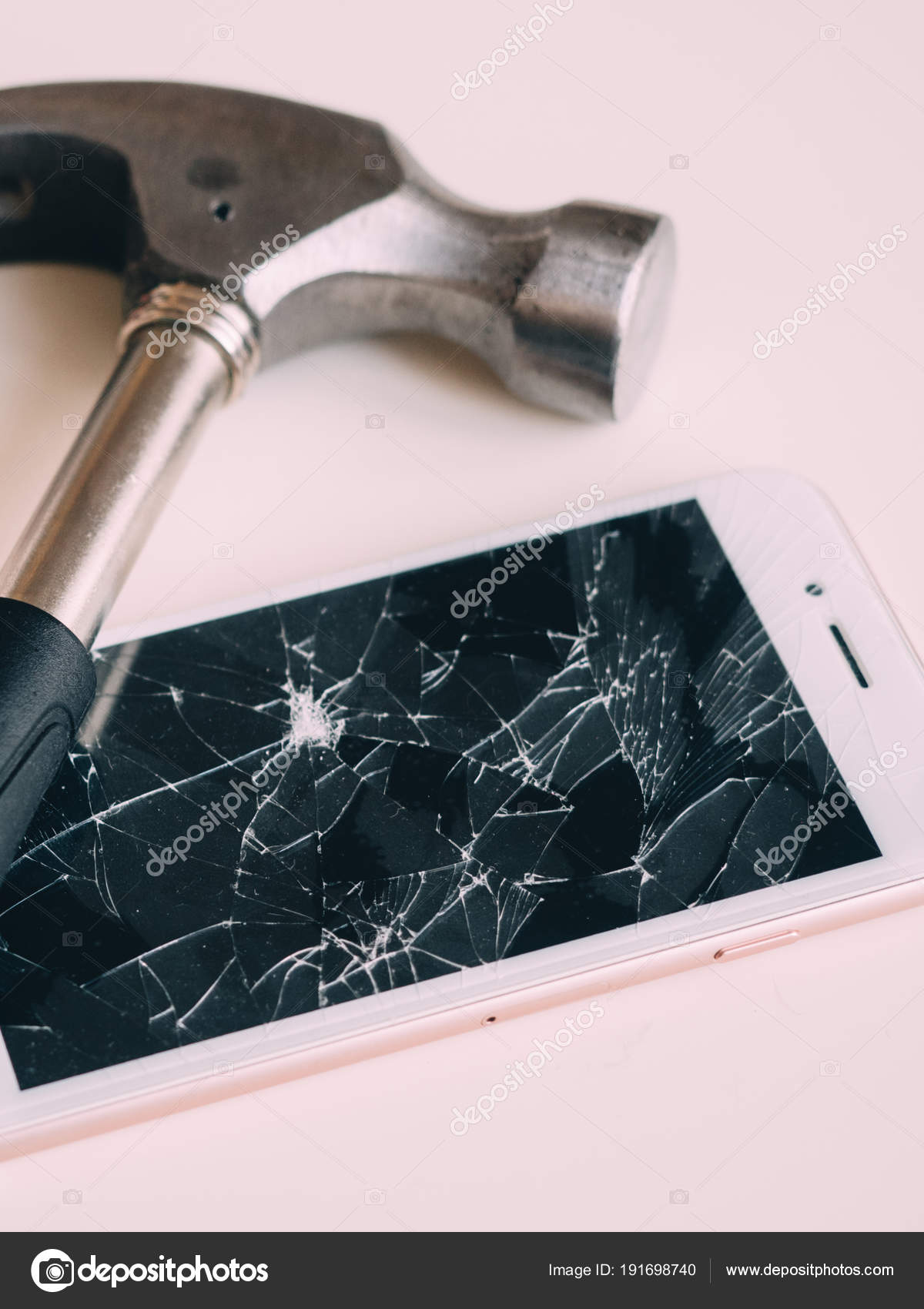 Broken screen of smartphone with hammer on white table — Stock Photo ...