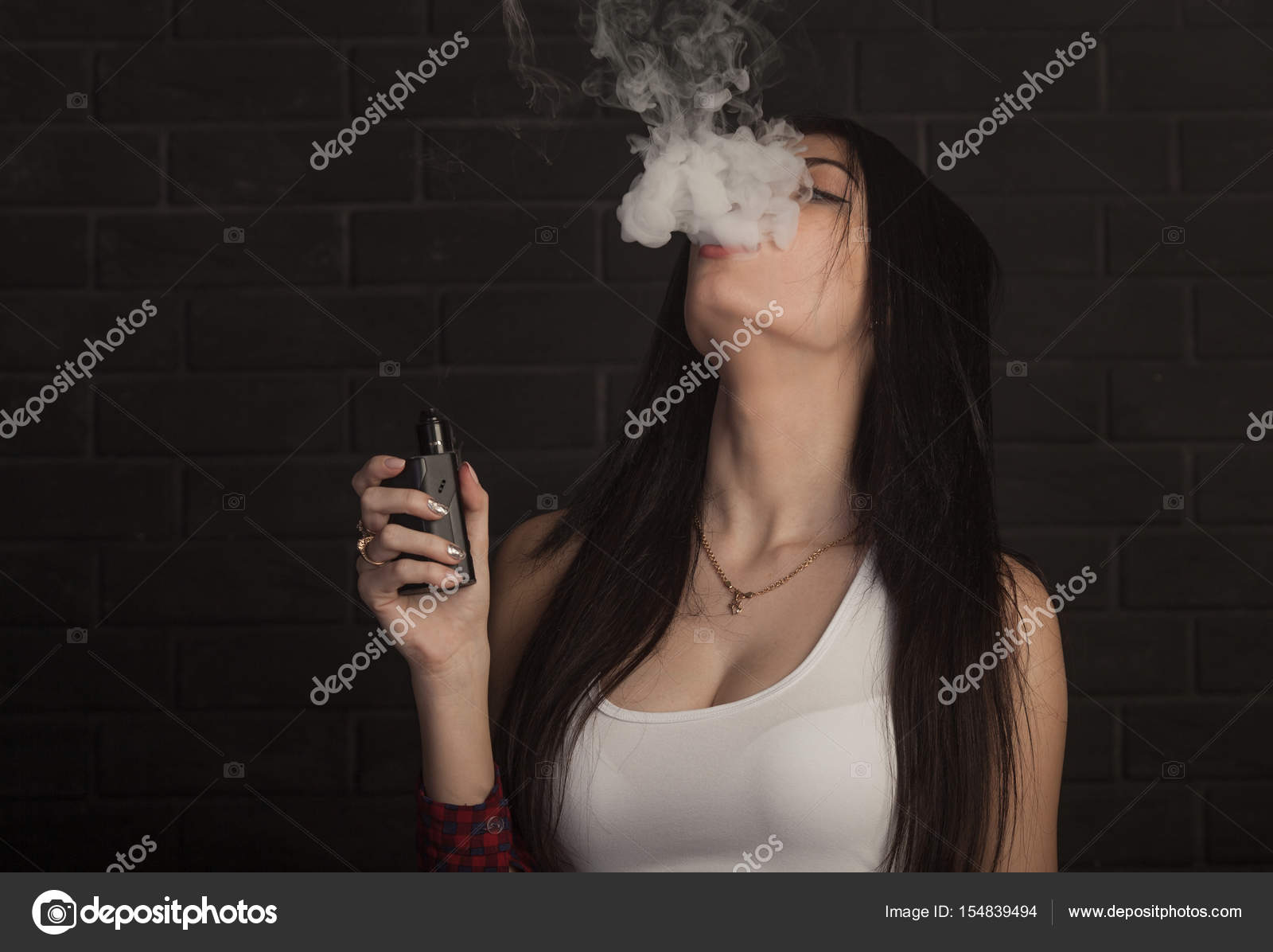 Young Beautiful Brunette Woman Smoking Vaping E Cigarette With Smoke