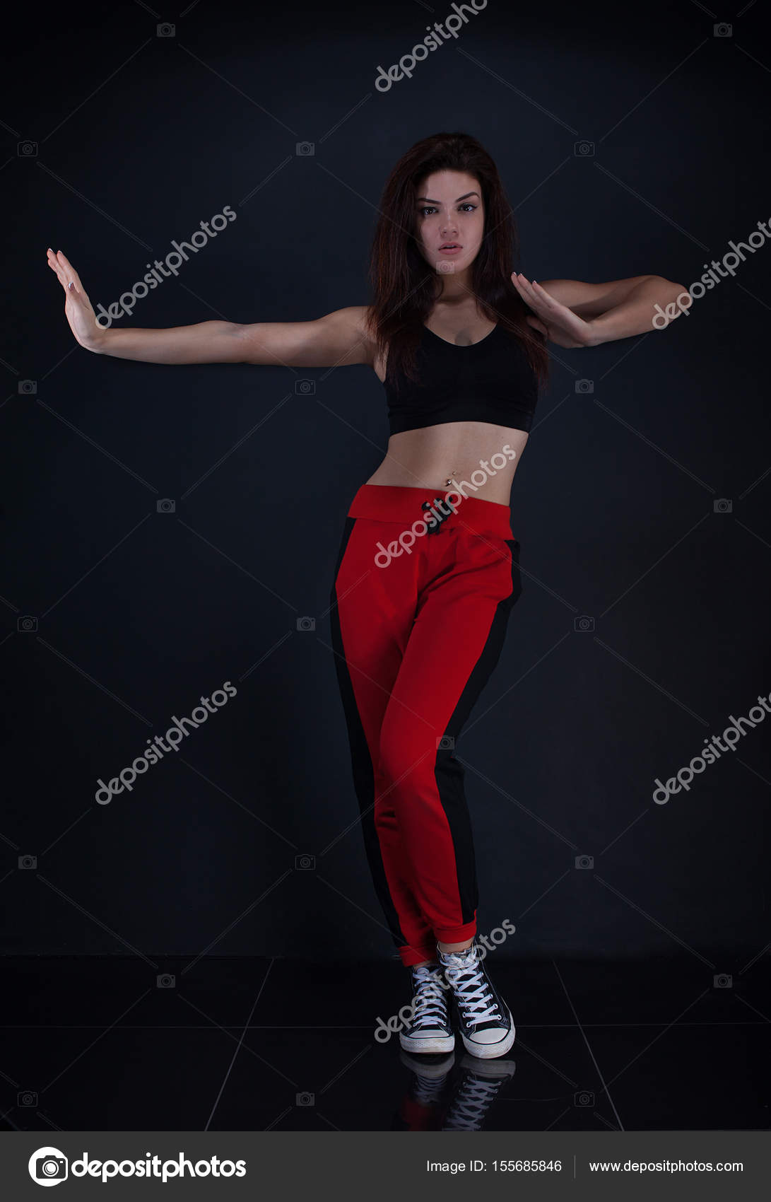 Young beautiful dancer posing on a studio background Stock Photo by ...