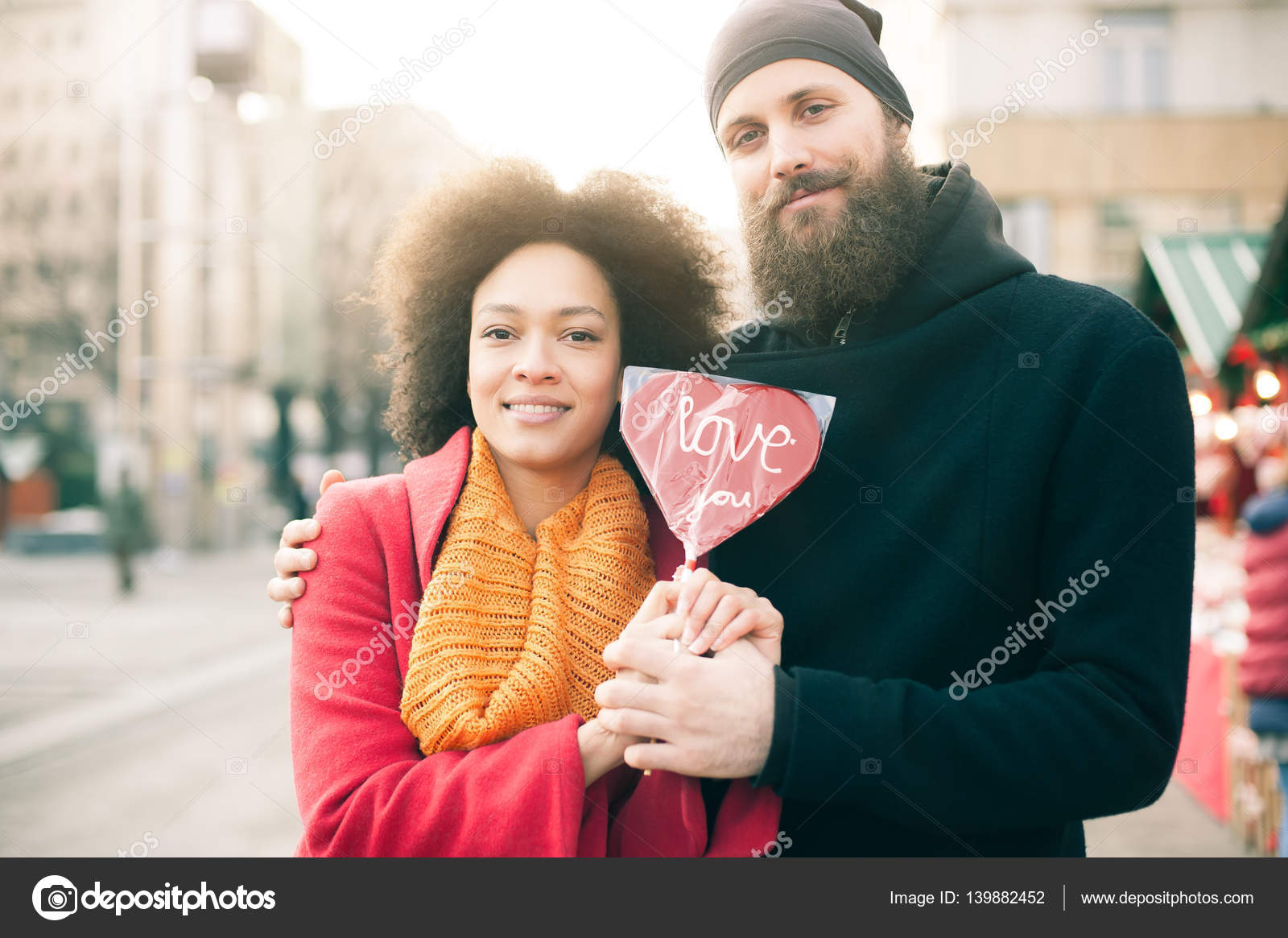Beautiful young lovers holding a big red heart Stock Photo by ©guruxox ...