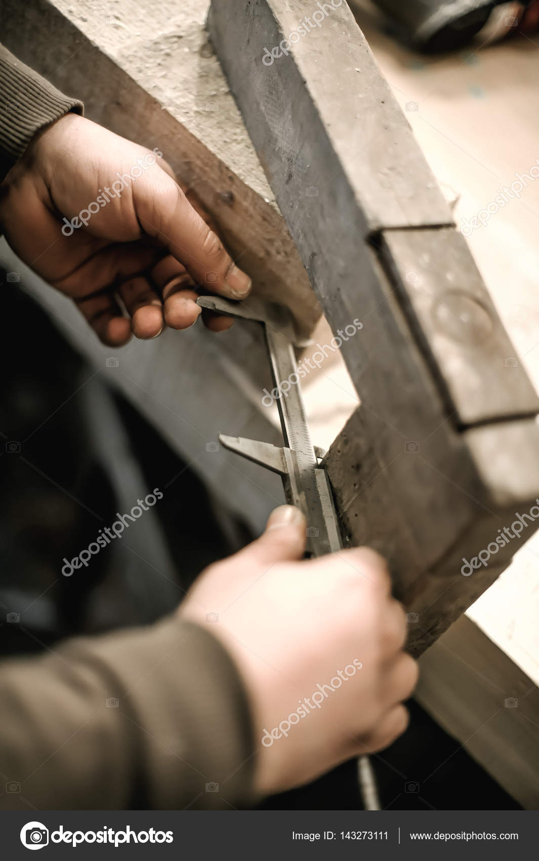 Carpenter using ruler for his job in carpentry workshop Stock Photo by ...