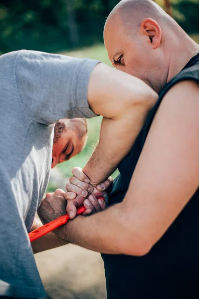 Self defense disarming technique against threat and knife attack Stock ...