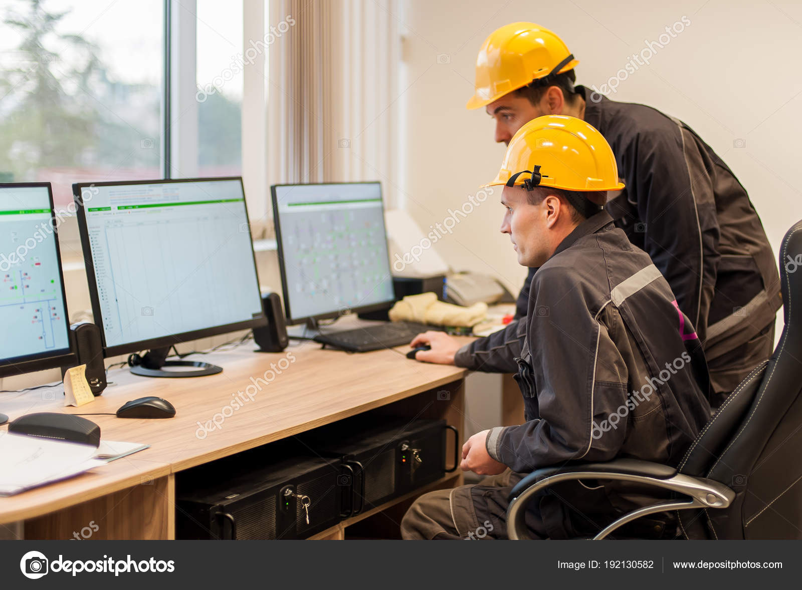 Field service engineers inspect relay protection system with lap Stock ...