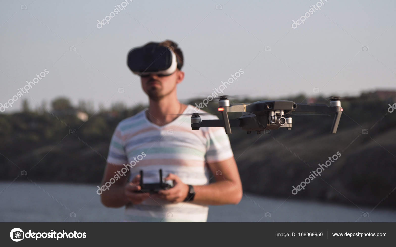 Man in VR glasses controlling drone — Stock Photo © EvgeniyShkolenko ...
