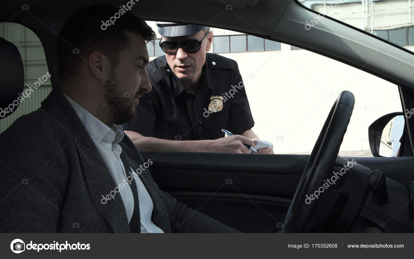 Policeman stopping a driver — Stock Photo © EvgeniyShkolenko #170352608