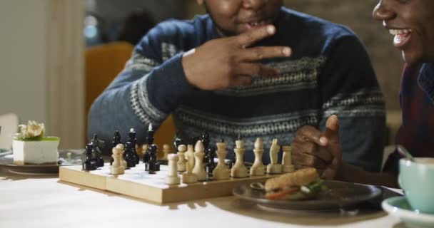 Content black men playing chess in cafeteria — Stock Video ...