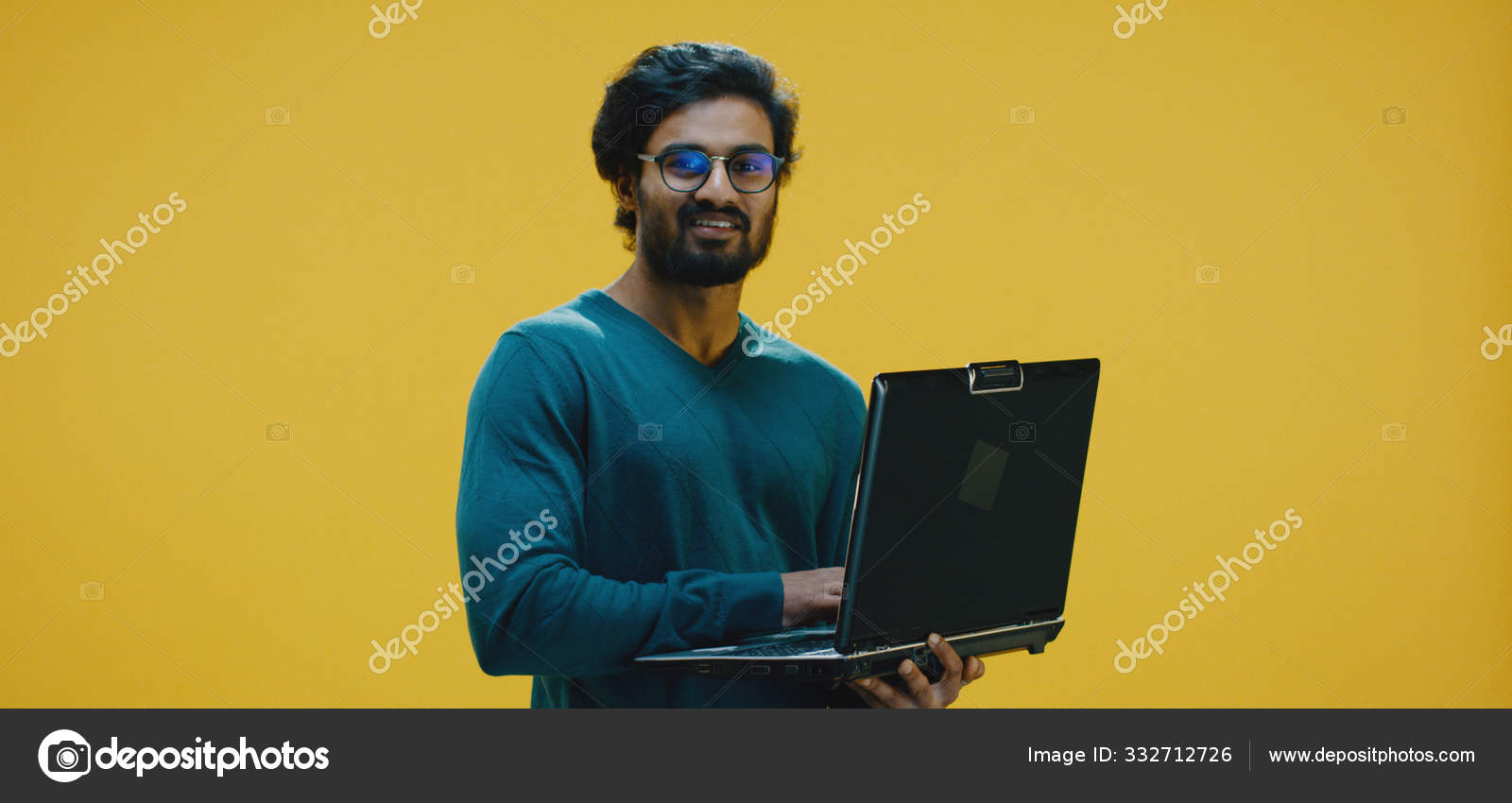 Young man typing on laptop — Stock Photo © EvgeniyShkolenko #332712726